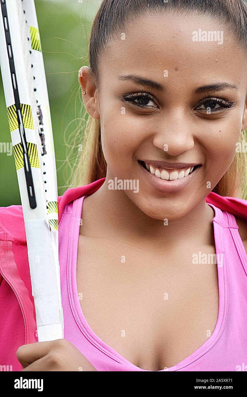 An Athletic Female Tennis Player Smiling Stock Photo - Alamy