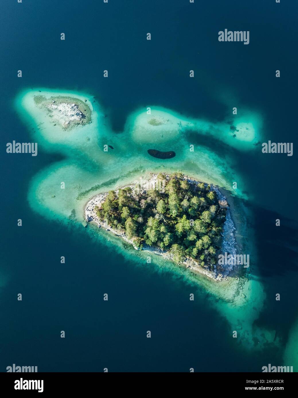 Turtles island, turquoise water, conifers, island, Eibsee lake, Germany ...