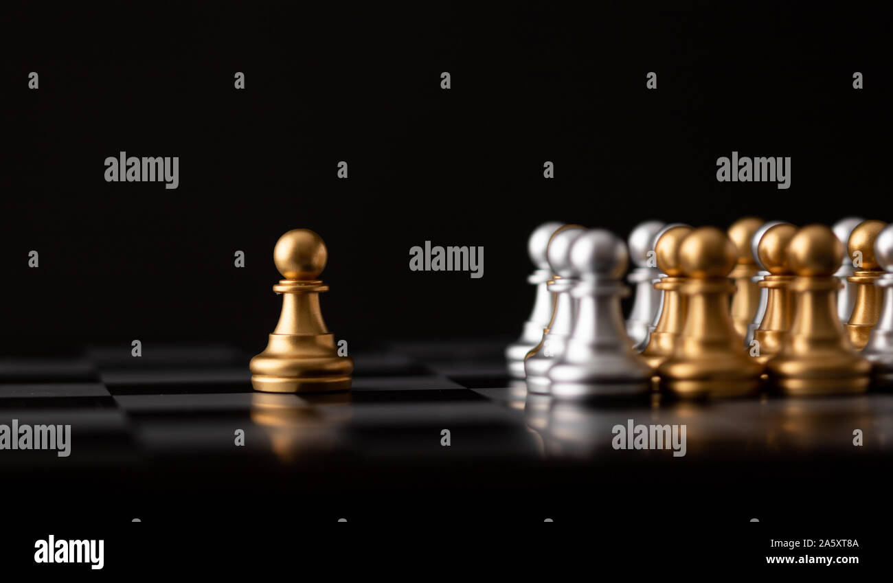 gold chessman is the leader of the chess in the game on board Stock ...