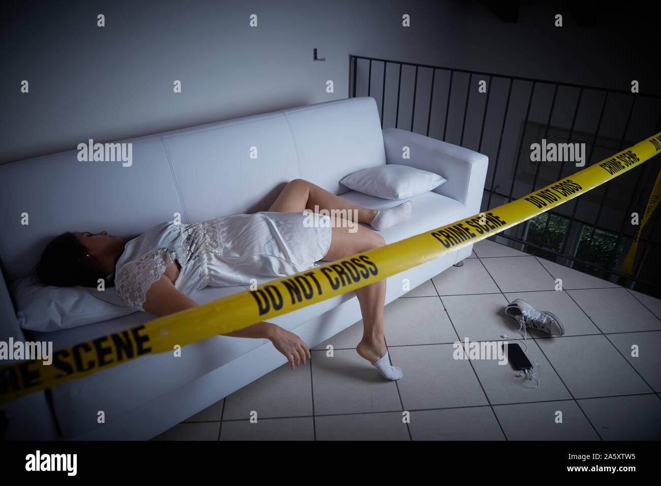 crime scene - woman liyng dead on the sofa Stock Photo - Alamy