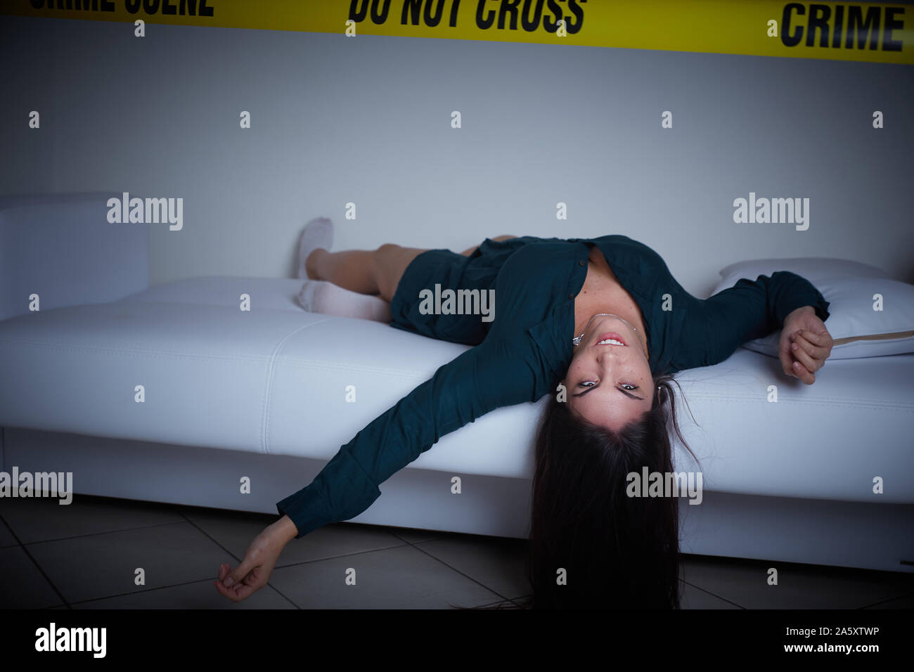 crime scene - woman liyng dead on the sofa Stock Photo - Alamy