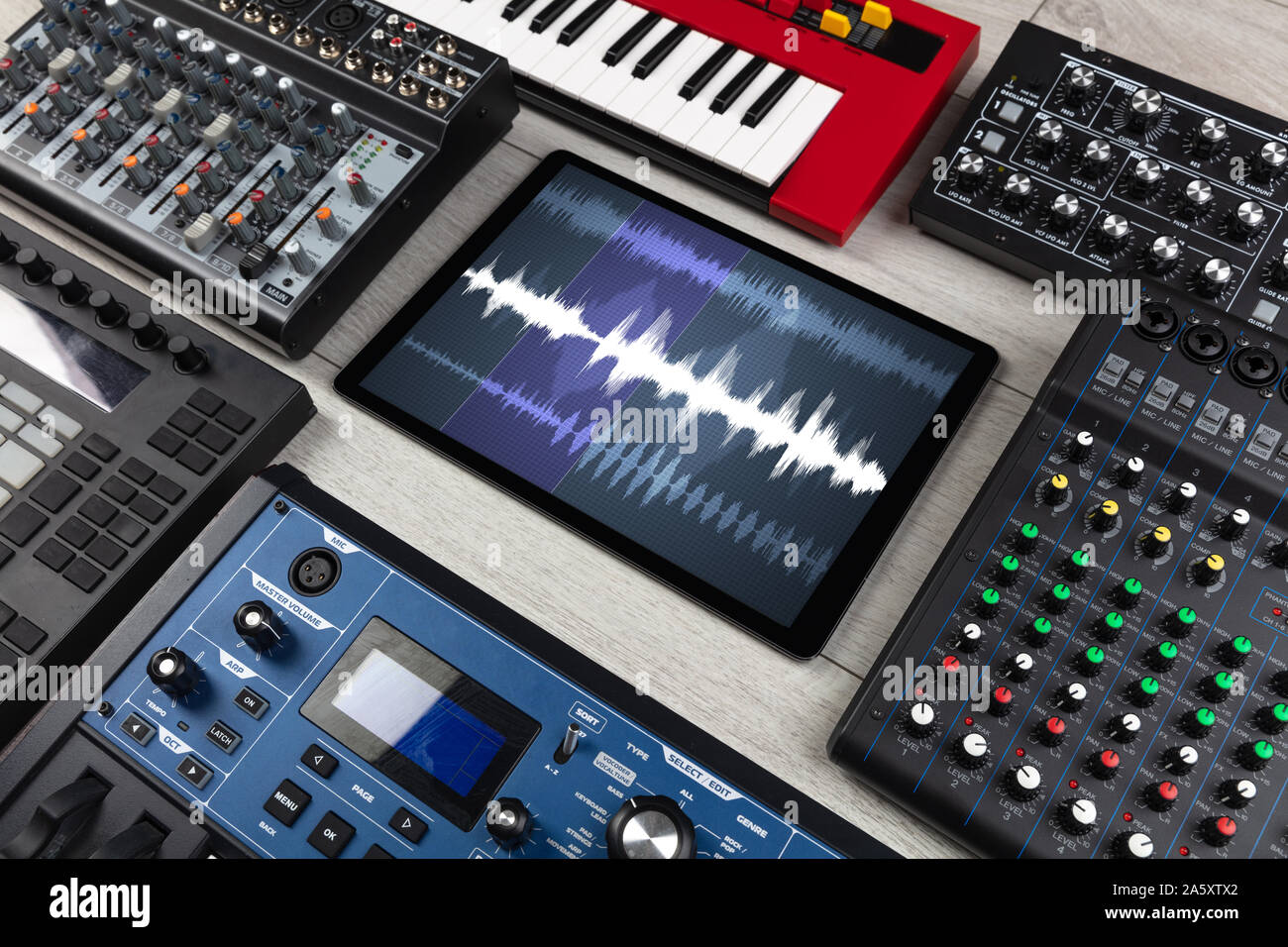 Recording music with tablet and electronic music instruments Stock ...