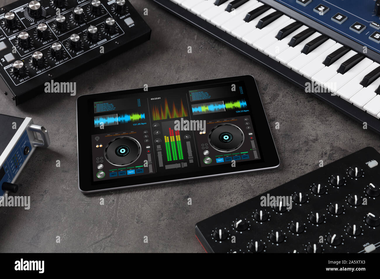 Mixing music on tablet with electronic music instruments concept Stock ...