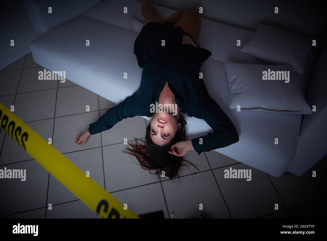 crime scene - woman liyng dead on the sofa Stock Photo - Alamy