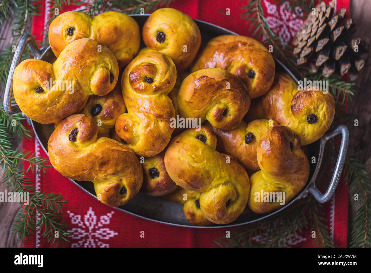 A tray of freshly baked homemade Swedish traditional saffron buns, also ...