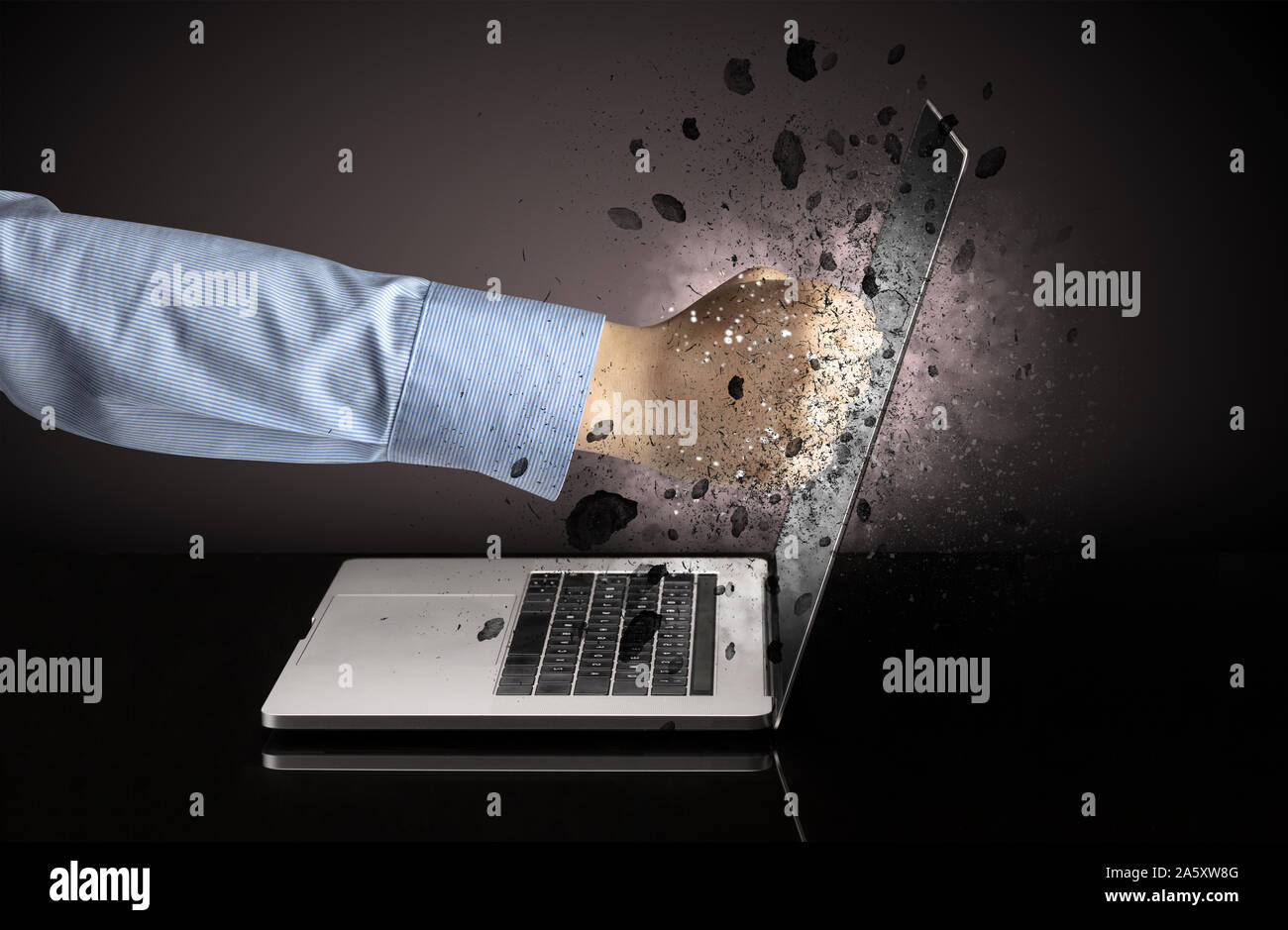 Strong male hand breaks laptop screen glasses Stock Photo - Alamy