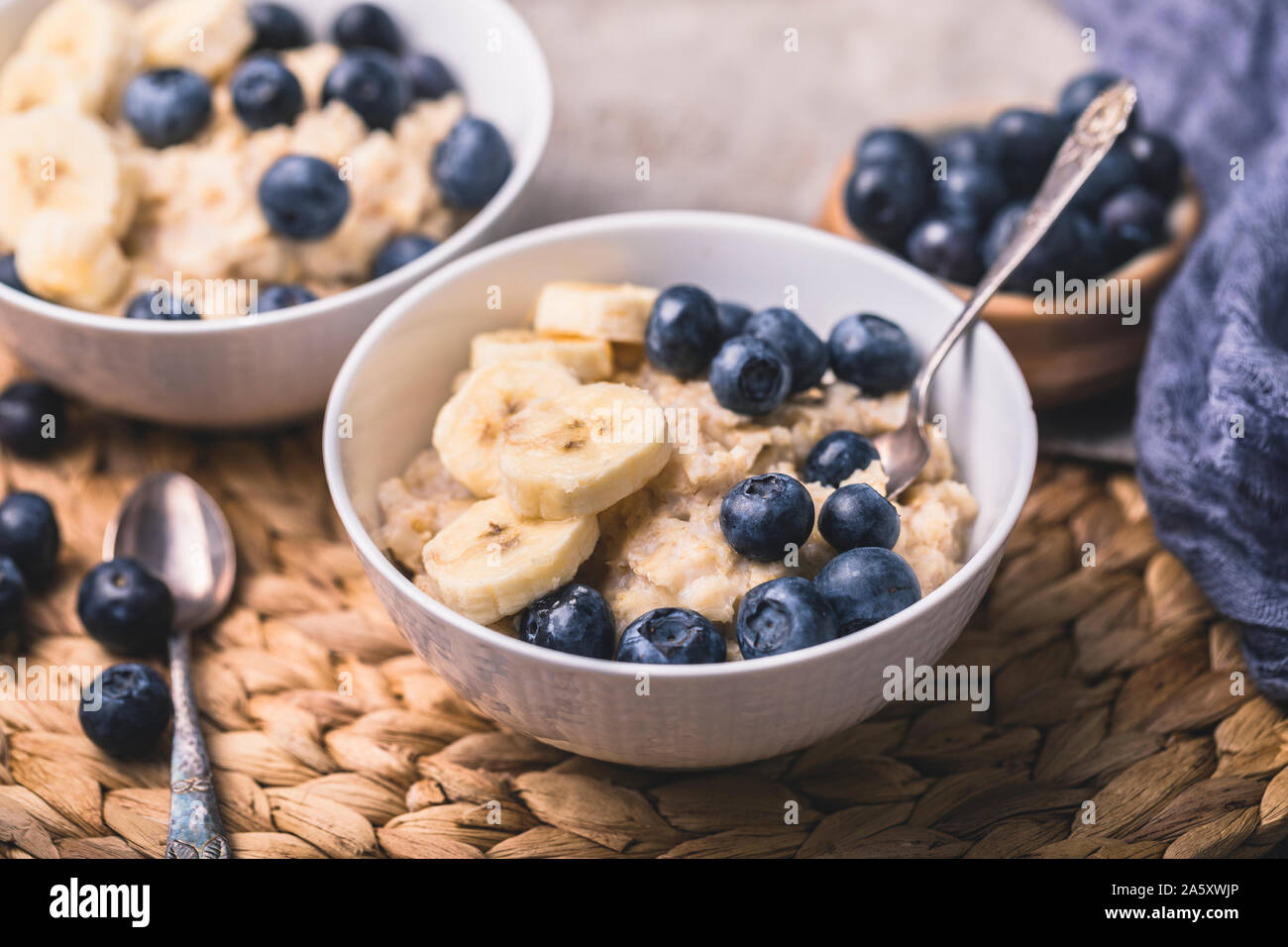 Healthy oatmeal porridge breakfast with fresh blueberries and sliced ...