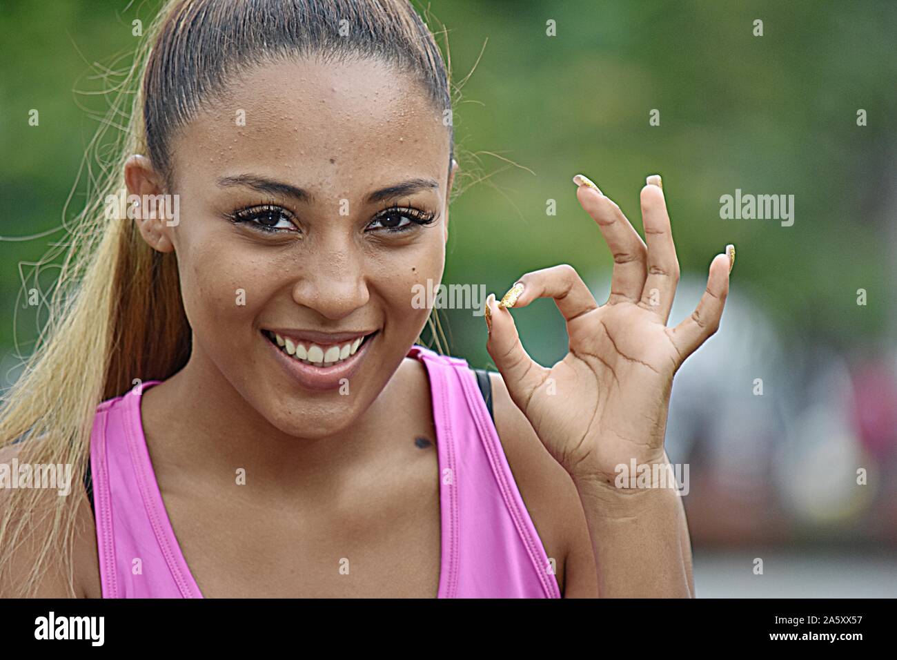 Girl And Okay Sign Stock Photo - Alamy