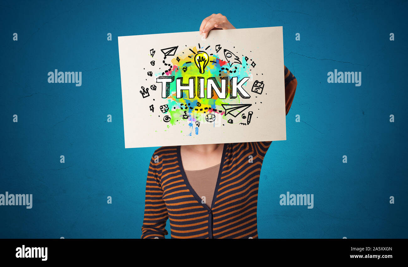 Young person holding paper with design thinking concept Stock Photo - Alamy