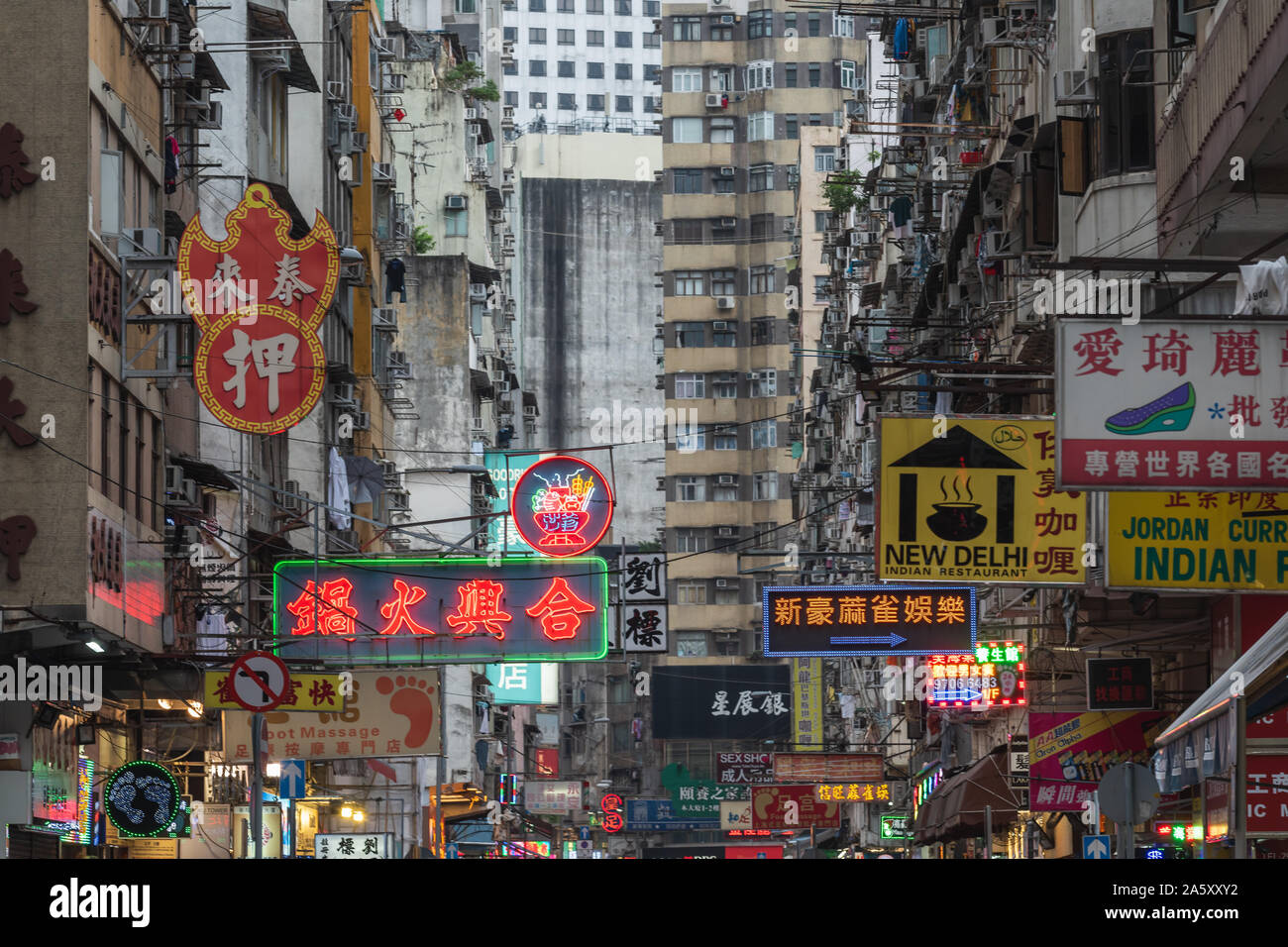 Vibrant neon signs and bright streetlights glowing above the busy night ...