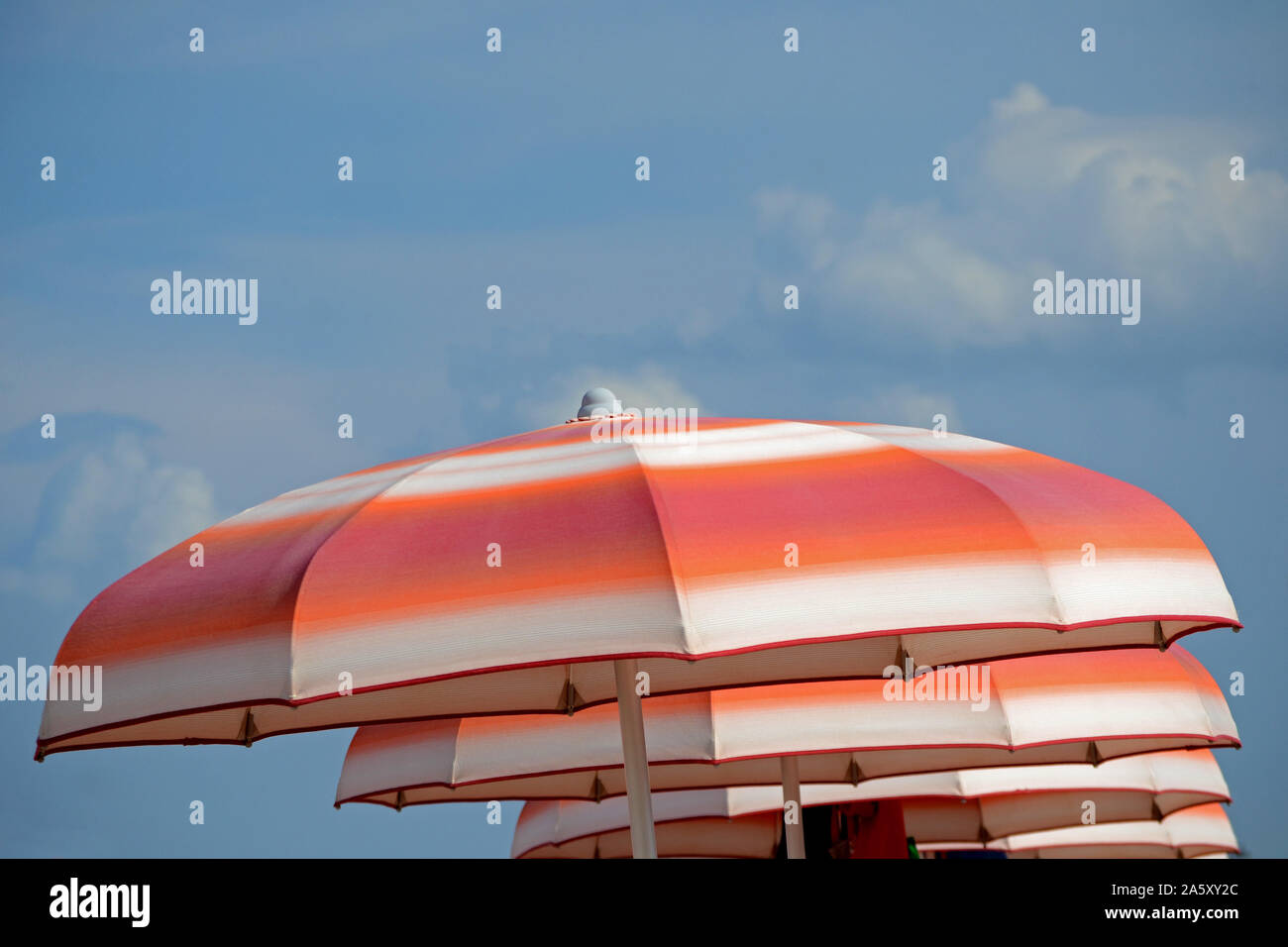 Red umbrella on a beach hi-res stock photography and images - Alamy