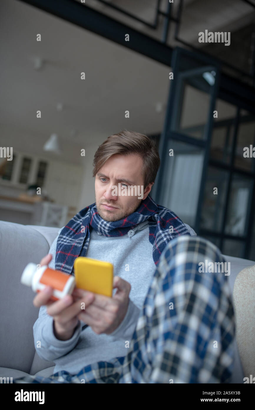 Mature adult doctor using smartphone hi-res stock photography and ...