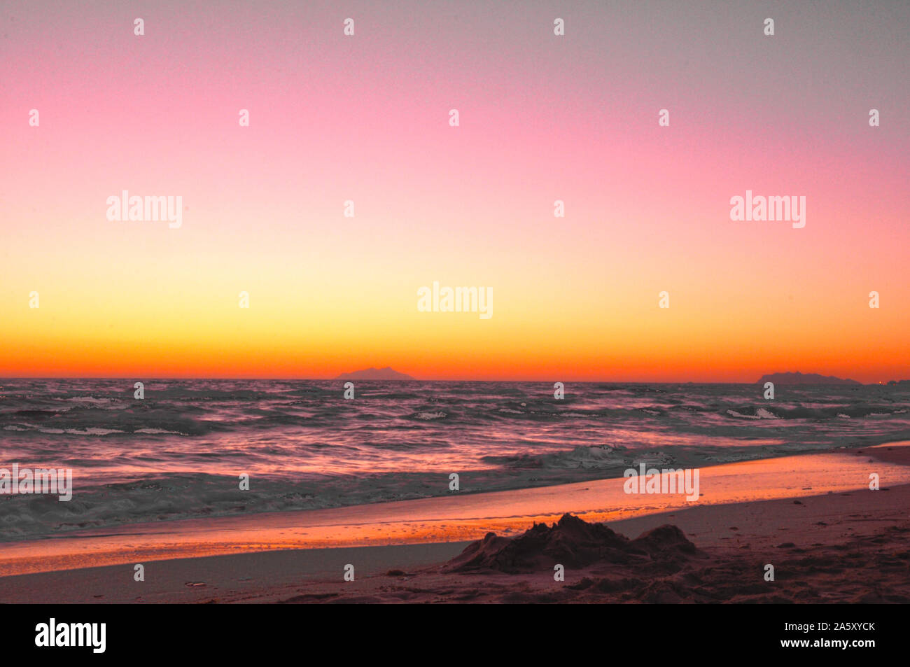 Sunset on beach - Marsala - Sicily Stock Photo - Alamy