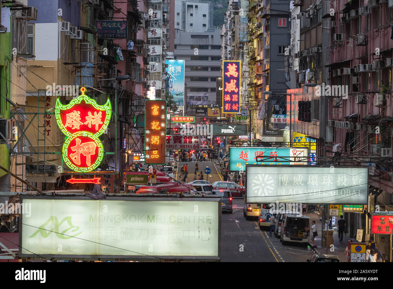Vibrant neon signs and bright streetlights glowing above the busy night ...