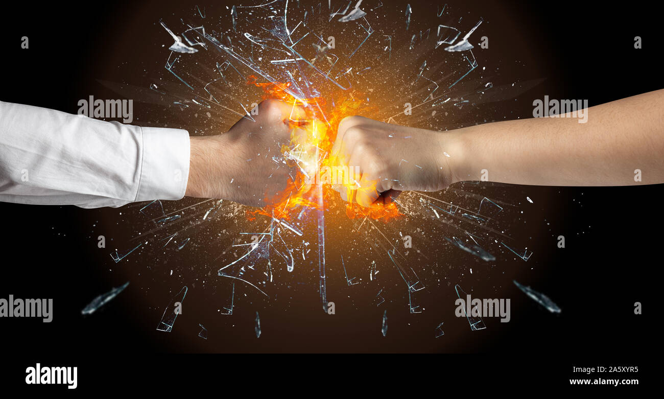 Two hands fighting and breaking a glass into small pieces Stock Photo ...