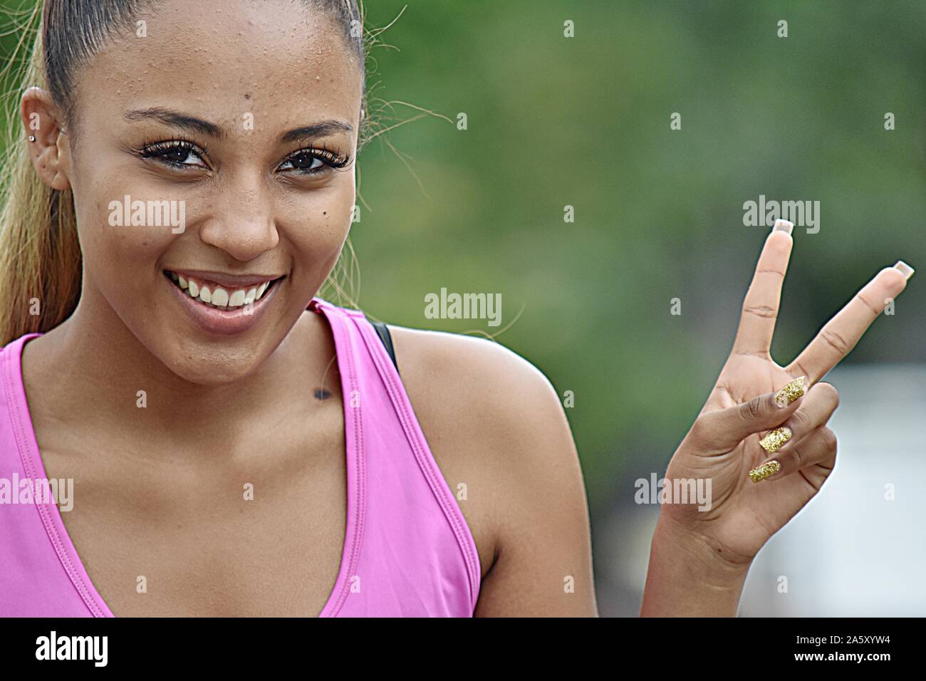 Girl And Peace Sign Stock Photo - Alamy