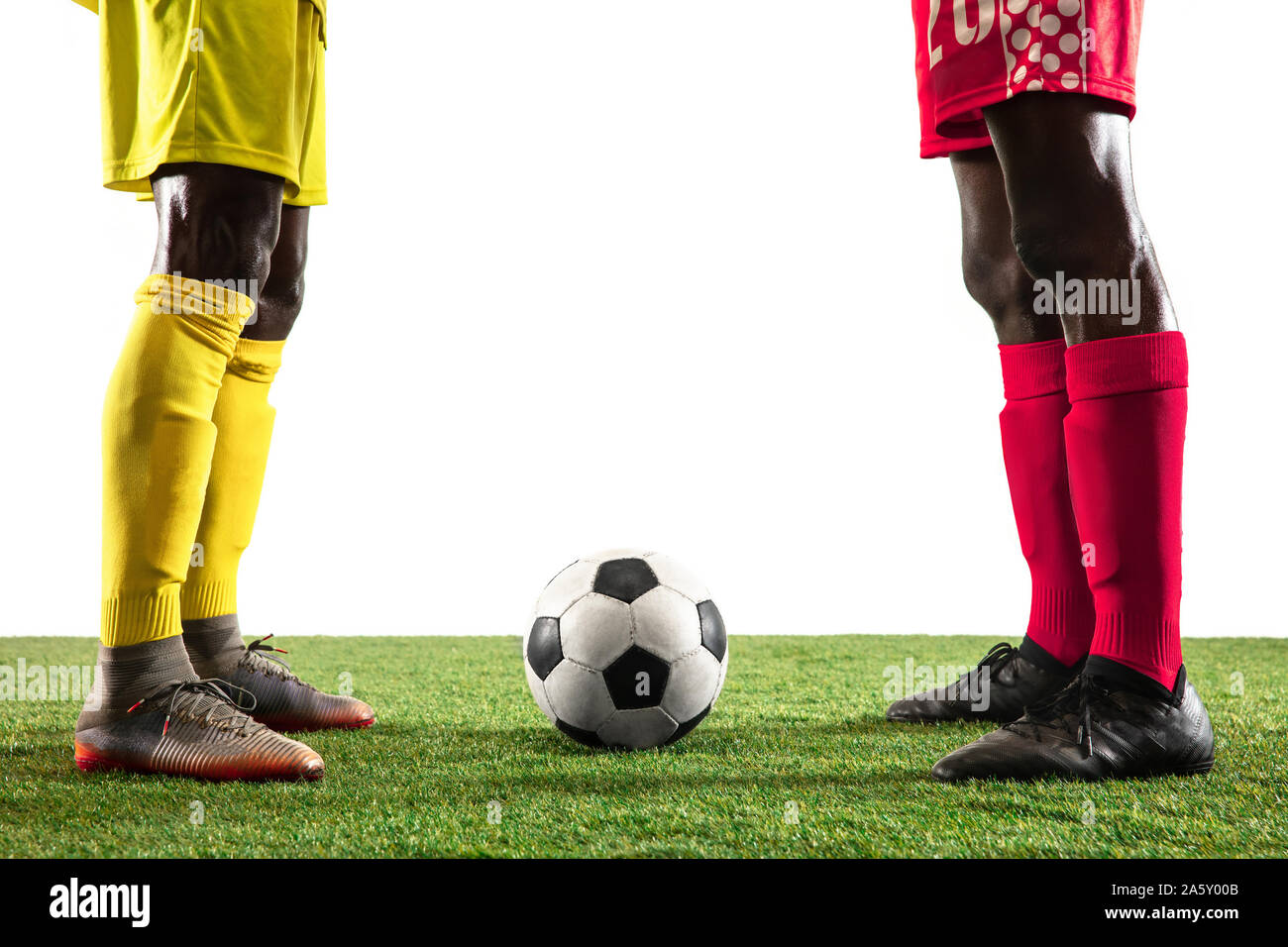 Professional african-american football or soccer players in play ...