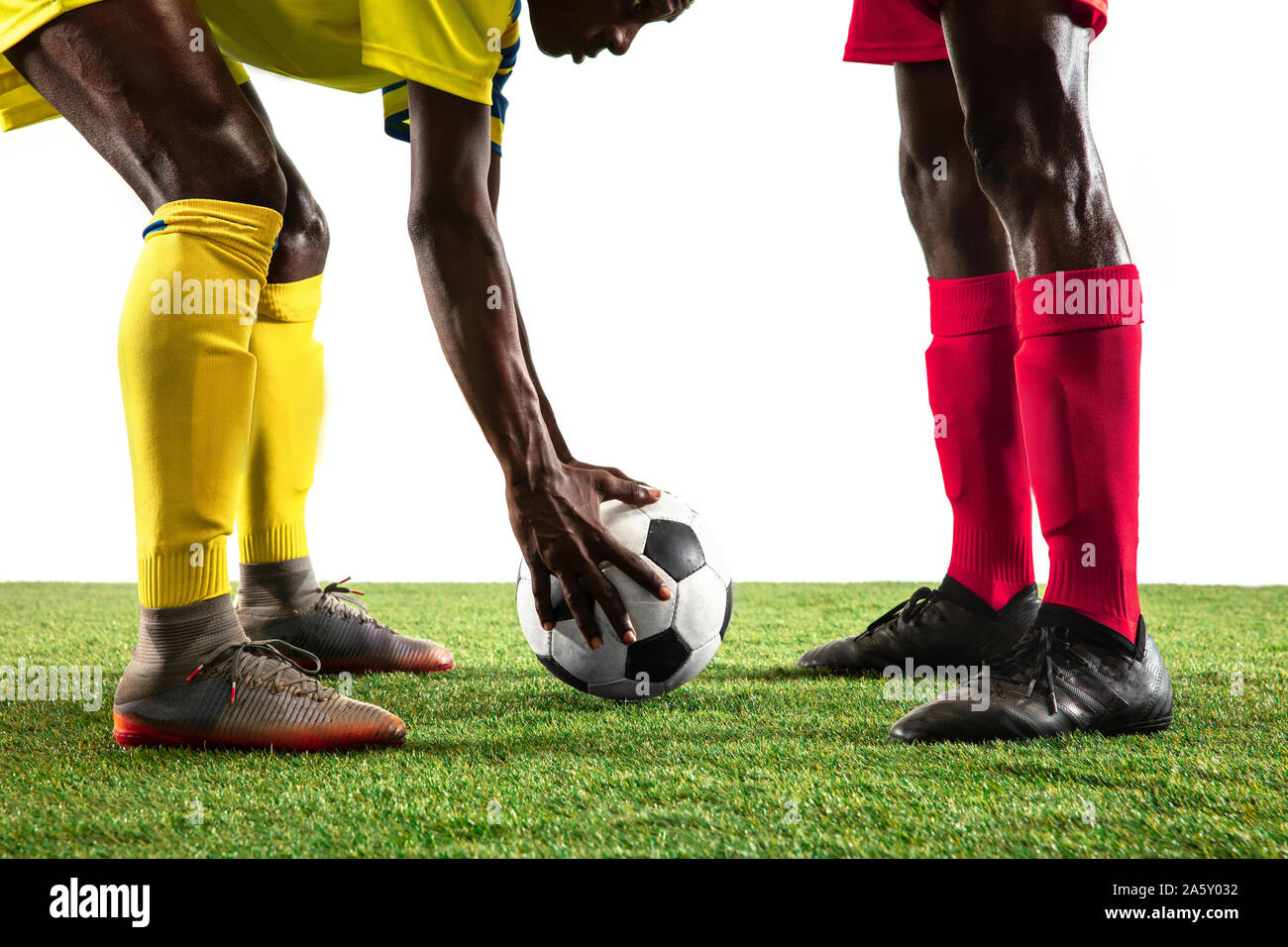 Professional african-american football or soccer players in play ...