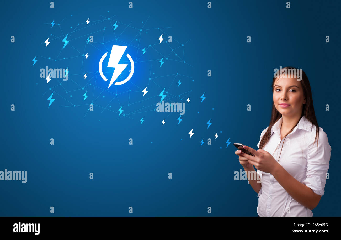 Young person using phone with power concept Stock Photo - Alamy
