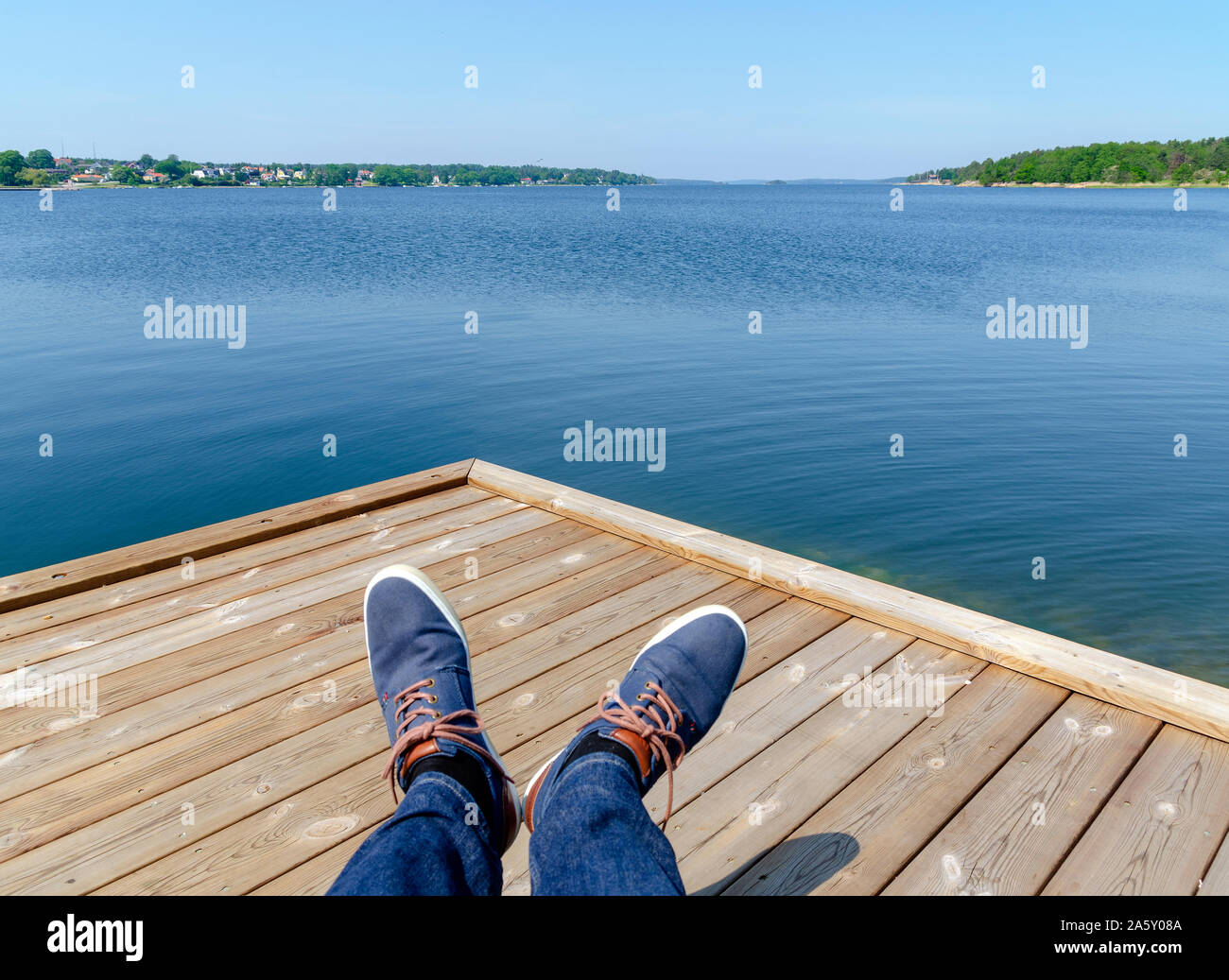 view above two blue shoed feet until the horizon to the archipelago of ...