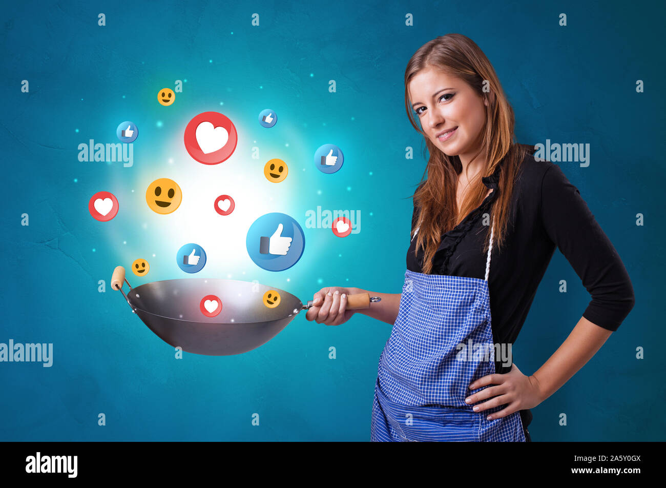 Young happy person cooking social media concept in wok Stock Photo - Alamy