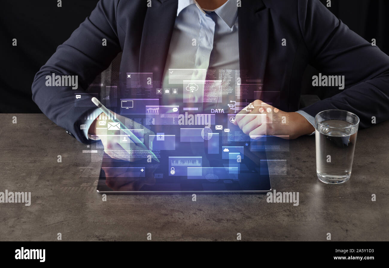 Business woman working on tablet with global database concept and dark ...