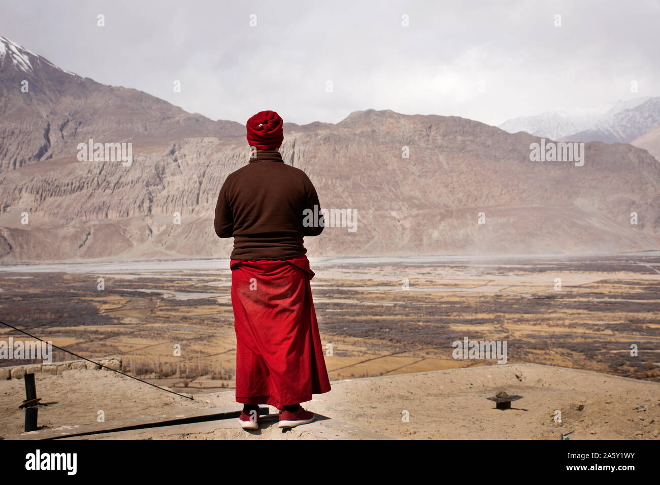 Tibetan monk pilgrim people stand on cliff Diskit Monastery Galdan ...