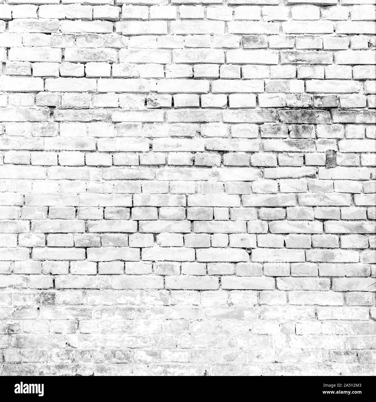 Loft styled white brick wall background Stock Photo - Alamy