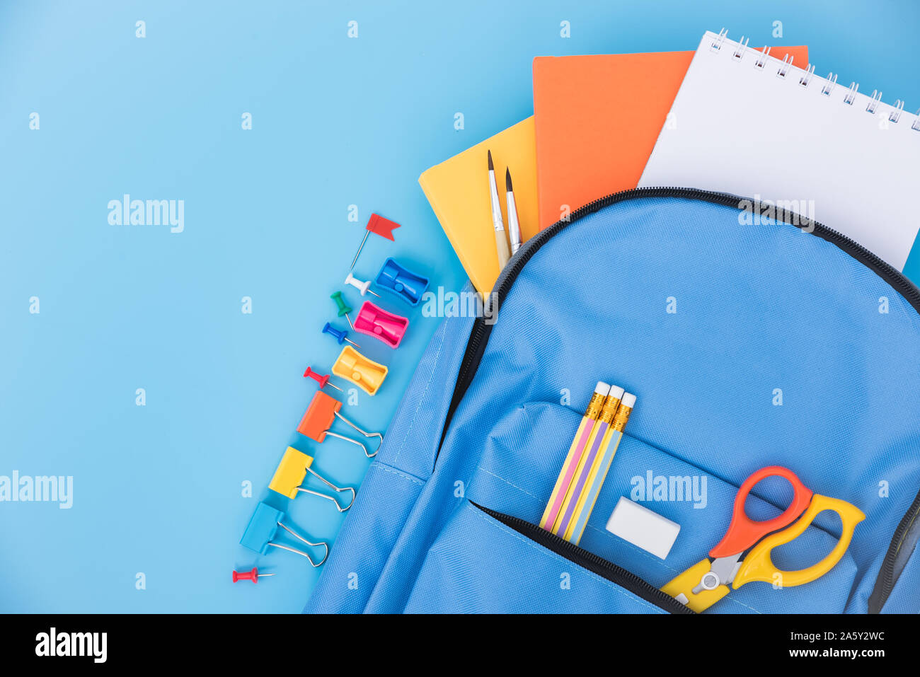 Top view Blue bag backpack for education children on blue background ...