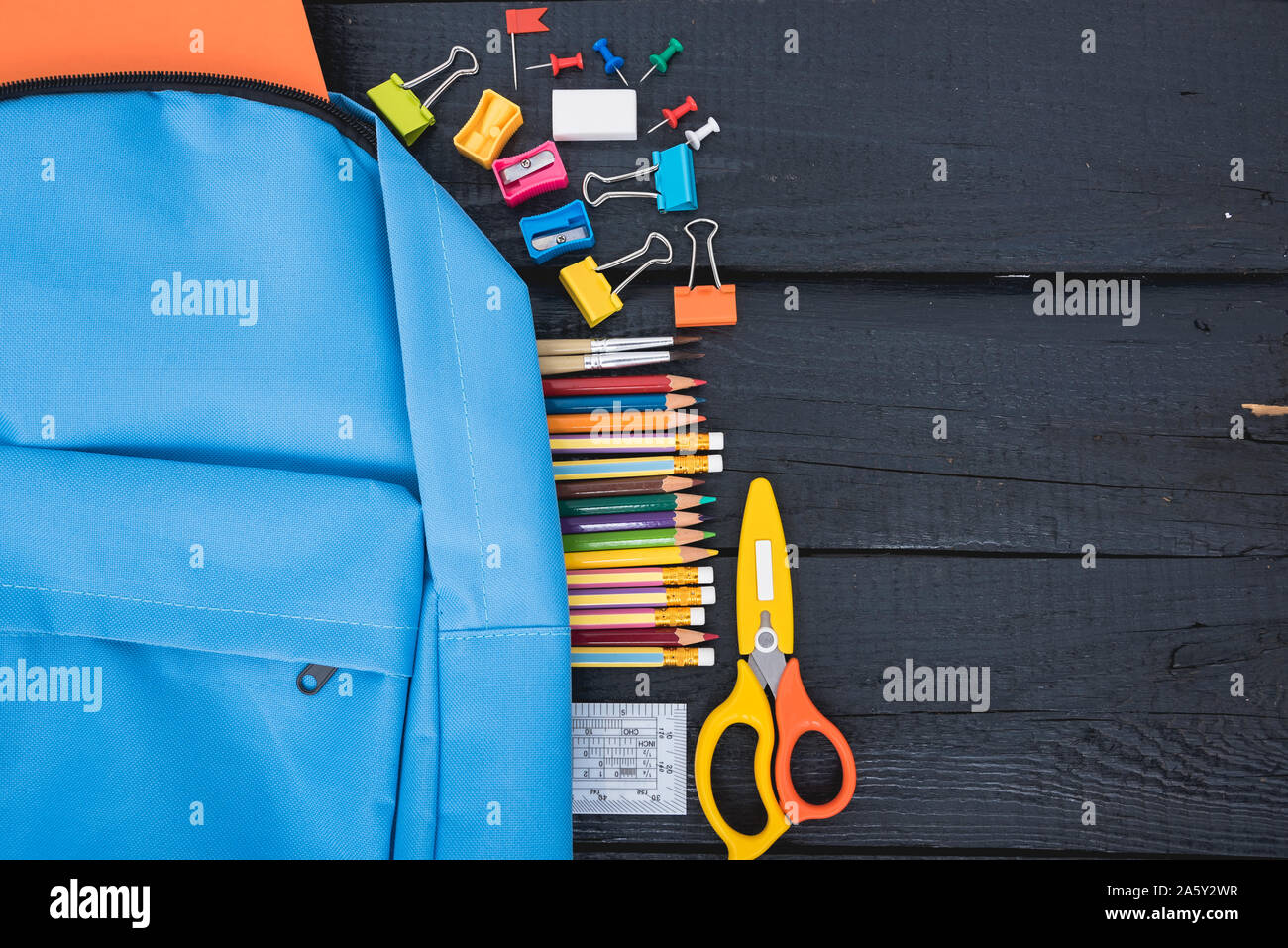 Top view Blue bag backpack for education children on black wooden ...