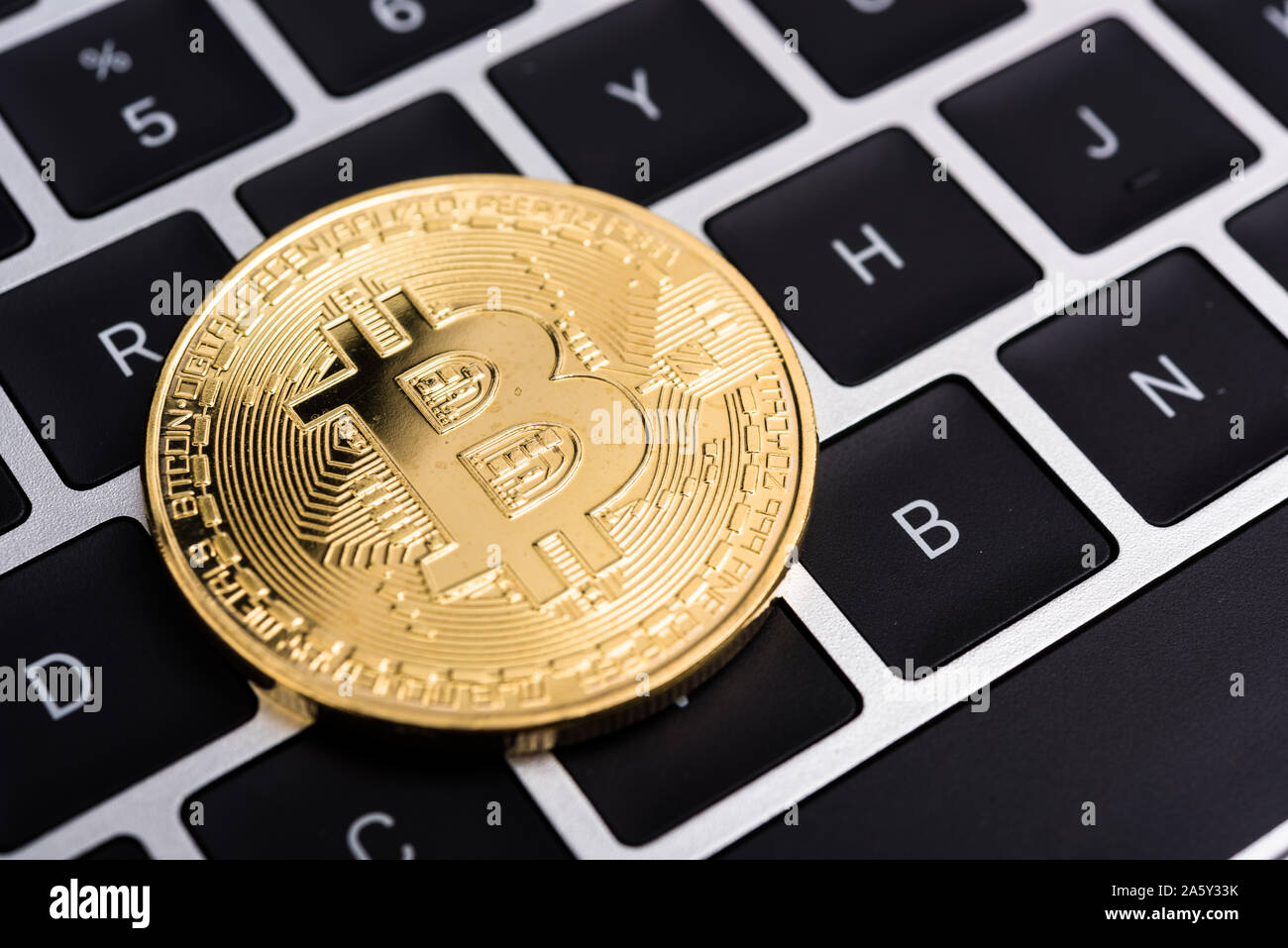 Coin, virtual golden bitcoin money on keyboard laptop computer Stock ...