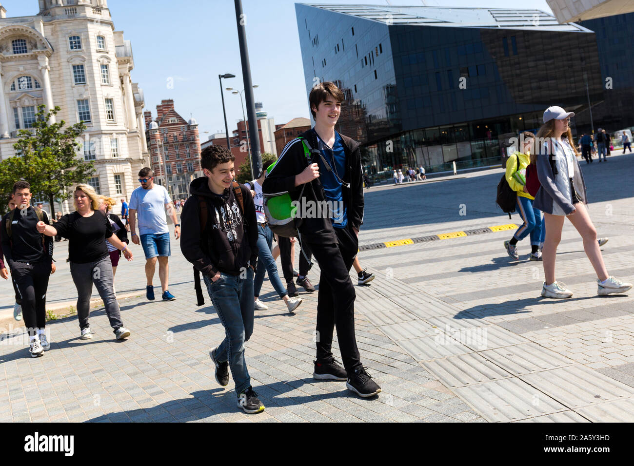 Liverpool and young people. Pedestrians at the waterfront. Merseyside ...