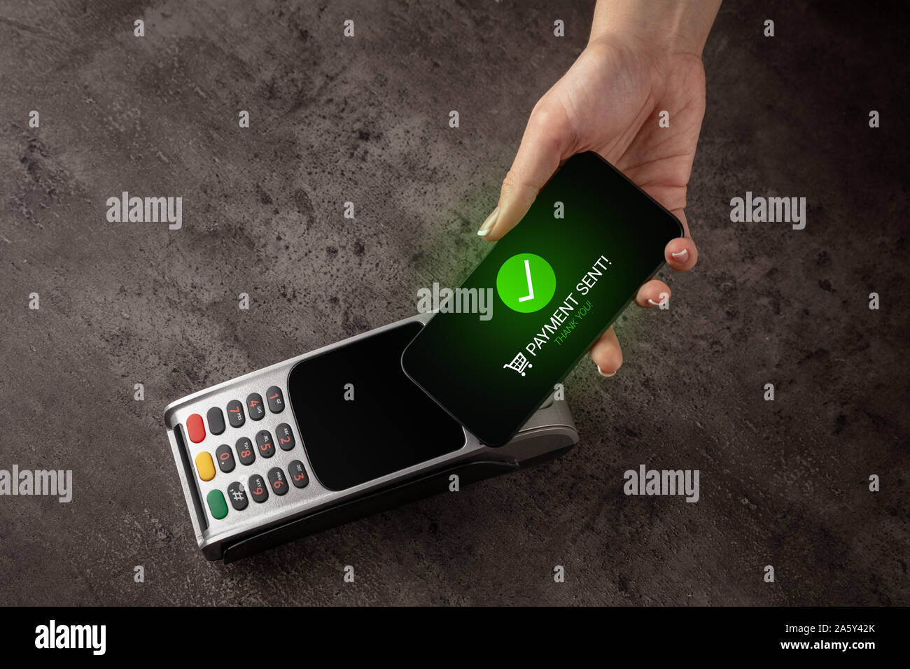 Mobile payment accepted on terminal Stock Photo - Alamy