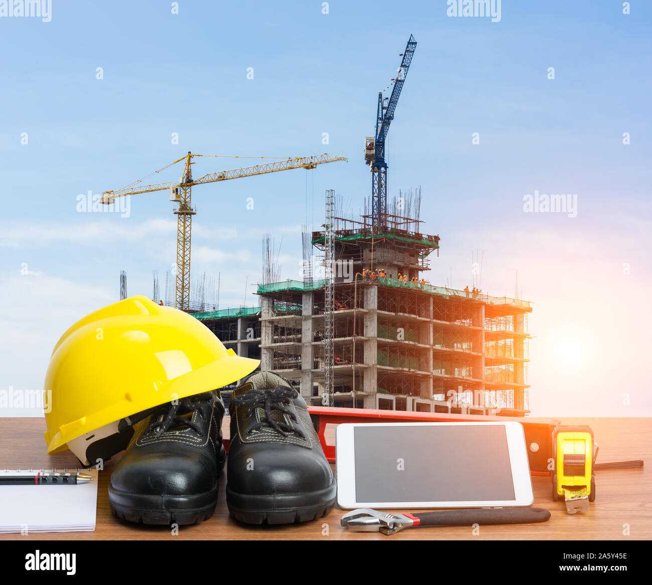 Working table engineer with tablet and tools in building construction ...