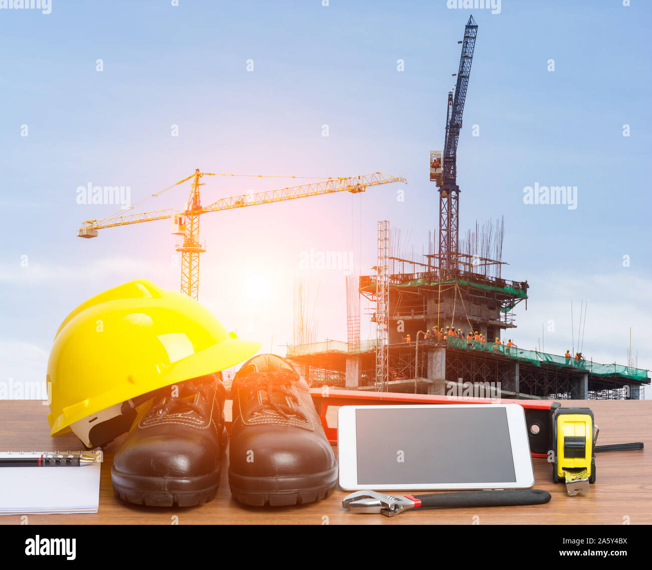 Working table engineer with tablet and tools in building construction ...