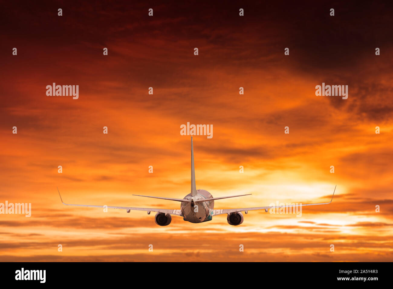 Airplane aft plane in the sky at sunset sky Stock Photo - Alamy