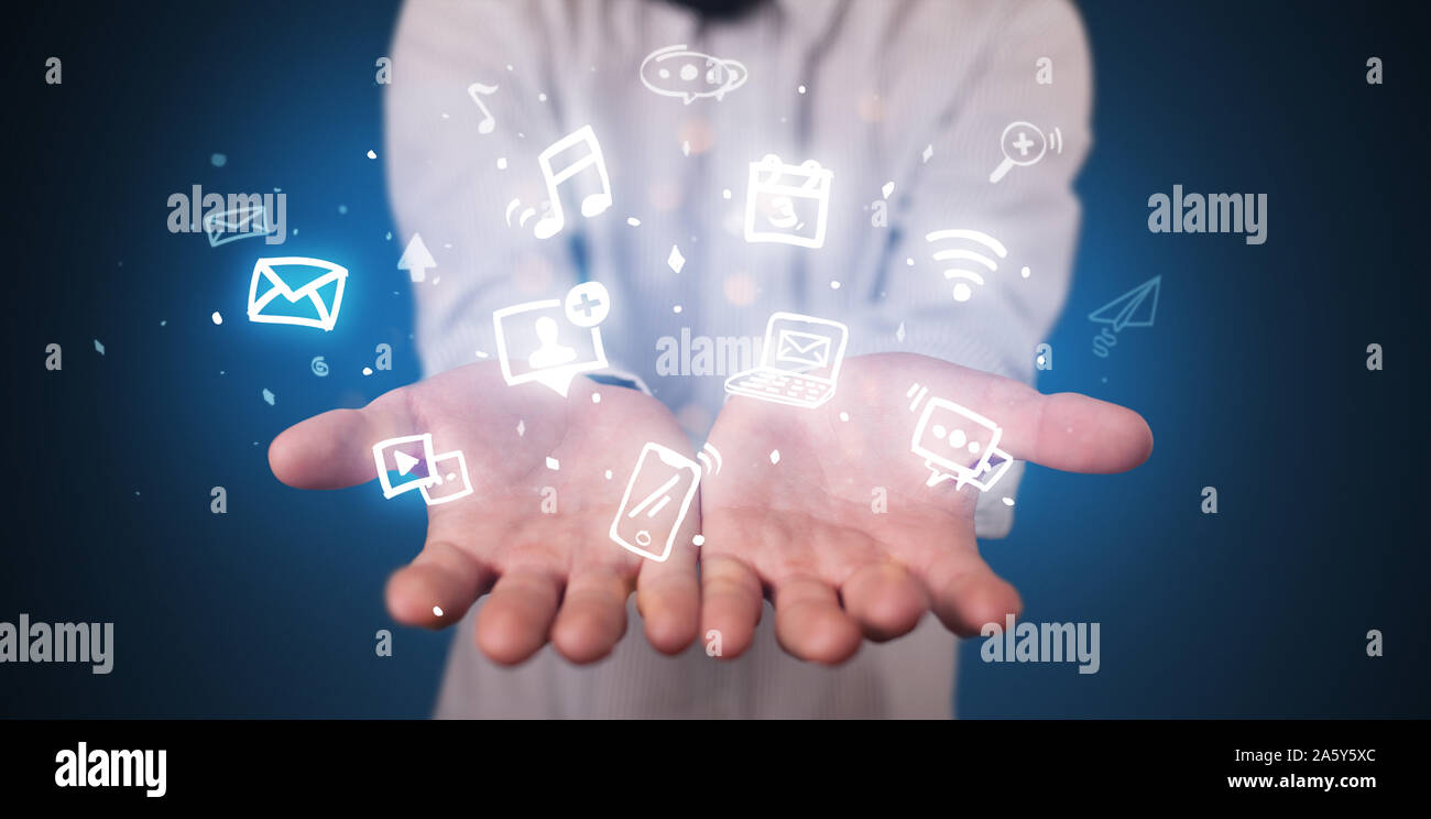 Hand holding application icons and symbols in her hand Stock Photo - Alamy
