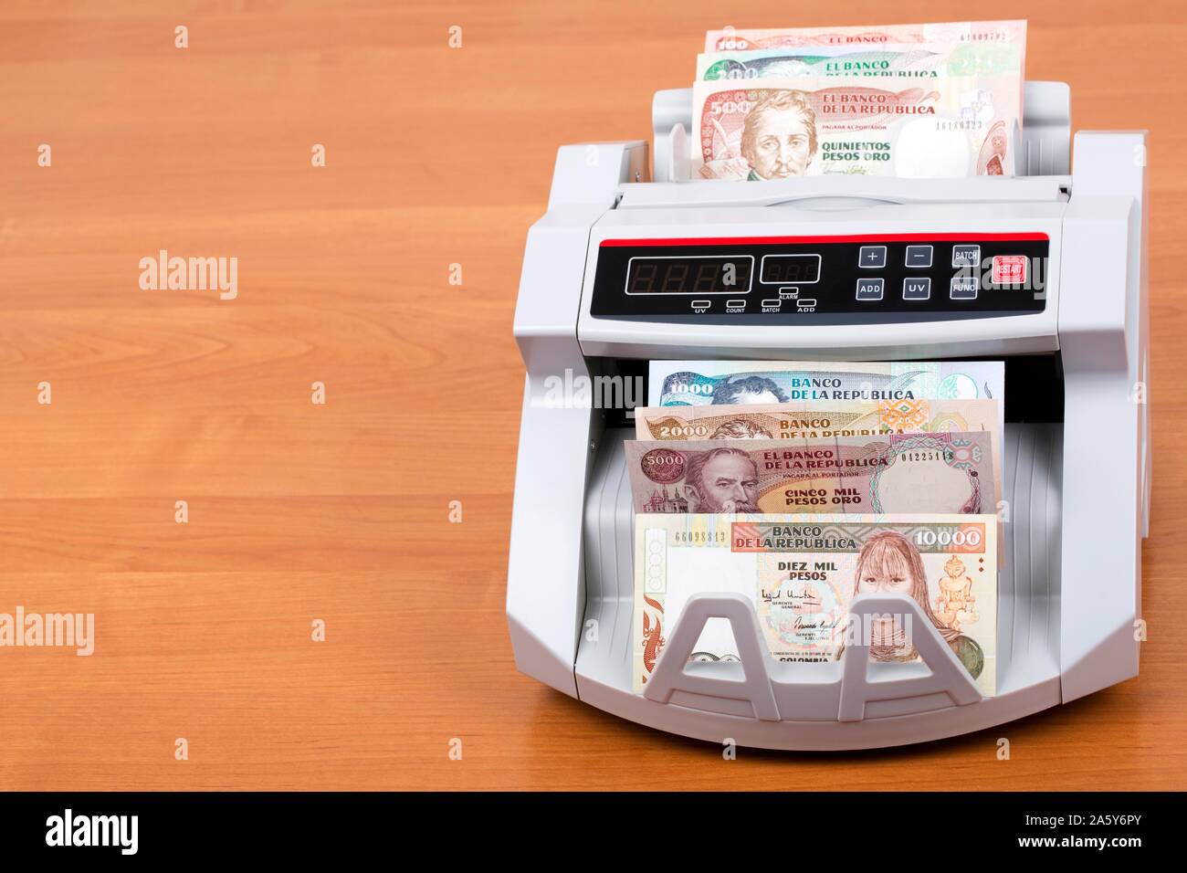 Old Colombian money in a counting machine Stock Photo - Alamy
