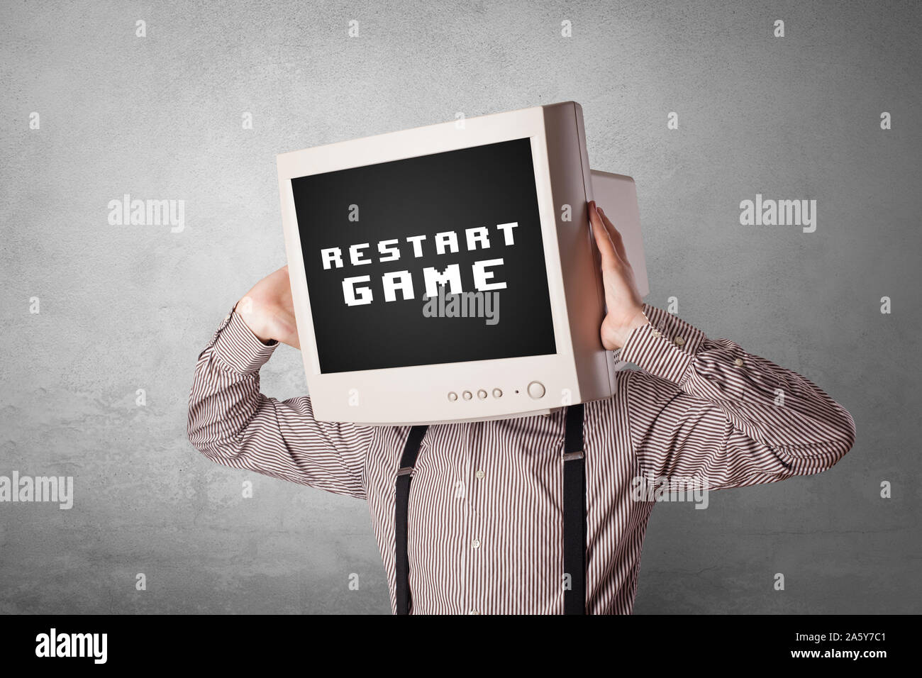 Young person with monitor head, gaming concept Stock Photo - Alamy