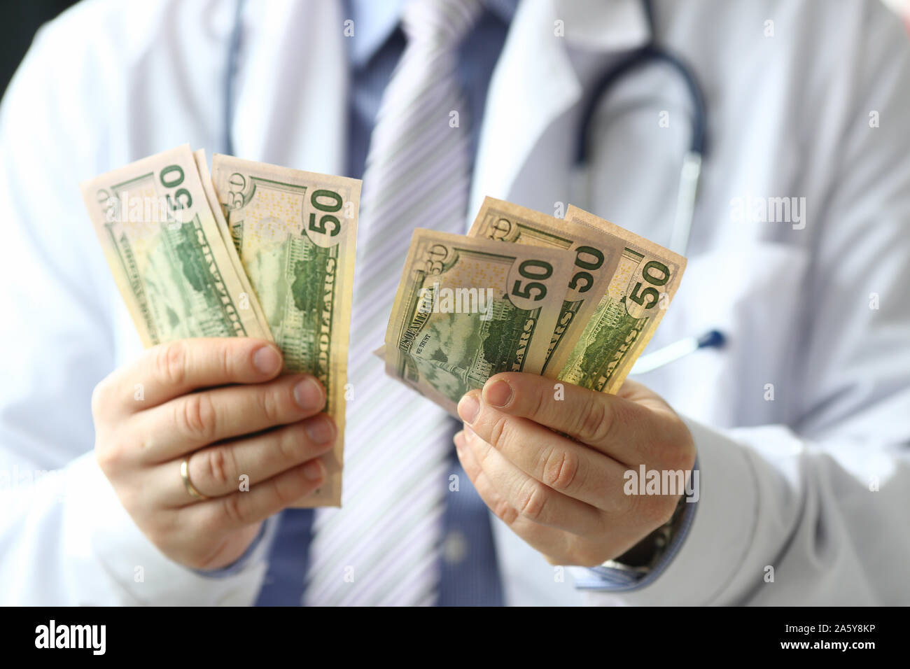 Counting money in hospital Stock Photo - Alamy