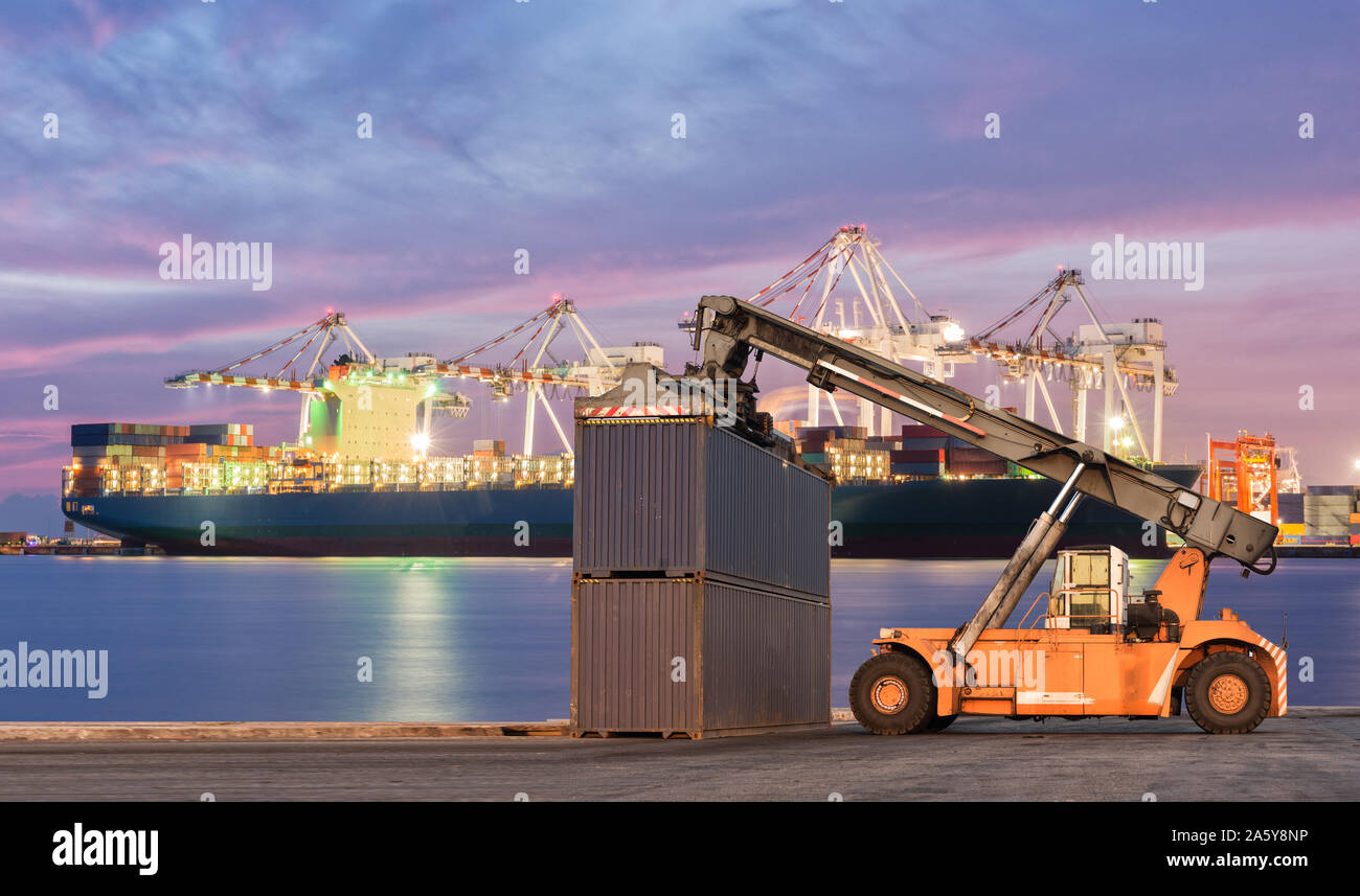 Forklift handling container box loading at port cargo Stock Photo - Alamy