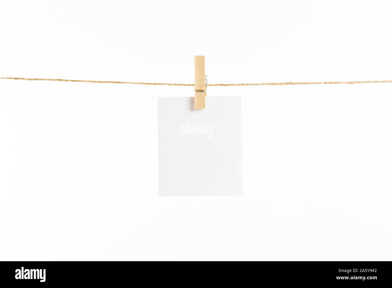 paper cards hanging rope isolated on white background Stock Photo - Alamy