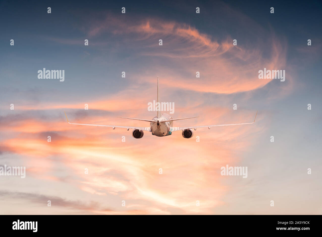 Airplane aft plane in the sky at sunset sky Stock Photo - Alamy