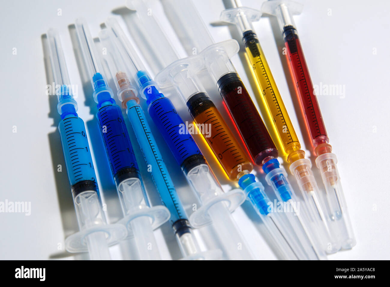 Medical syringes with colorful injections for cosmetology. Syringes ...