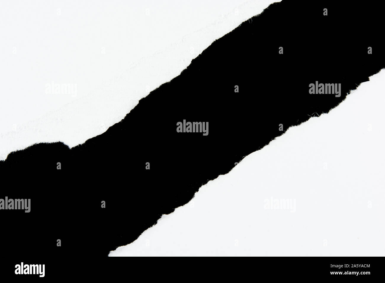 tear white paper pieces of paper on black background Stock Photo - Alamy