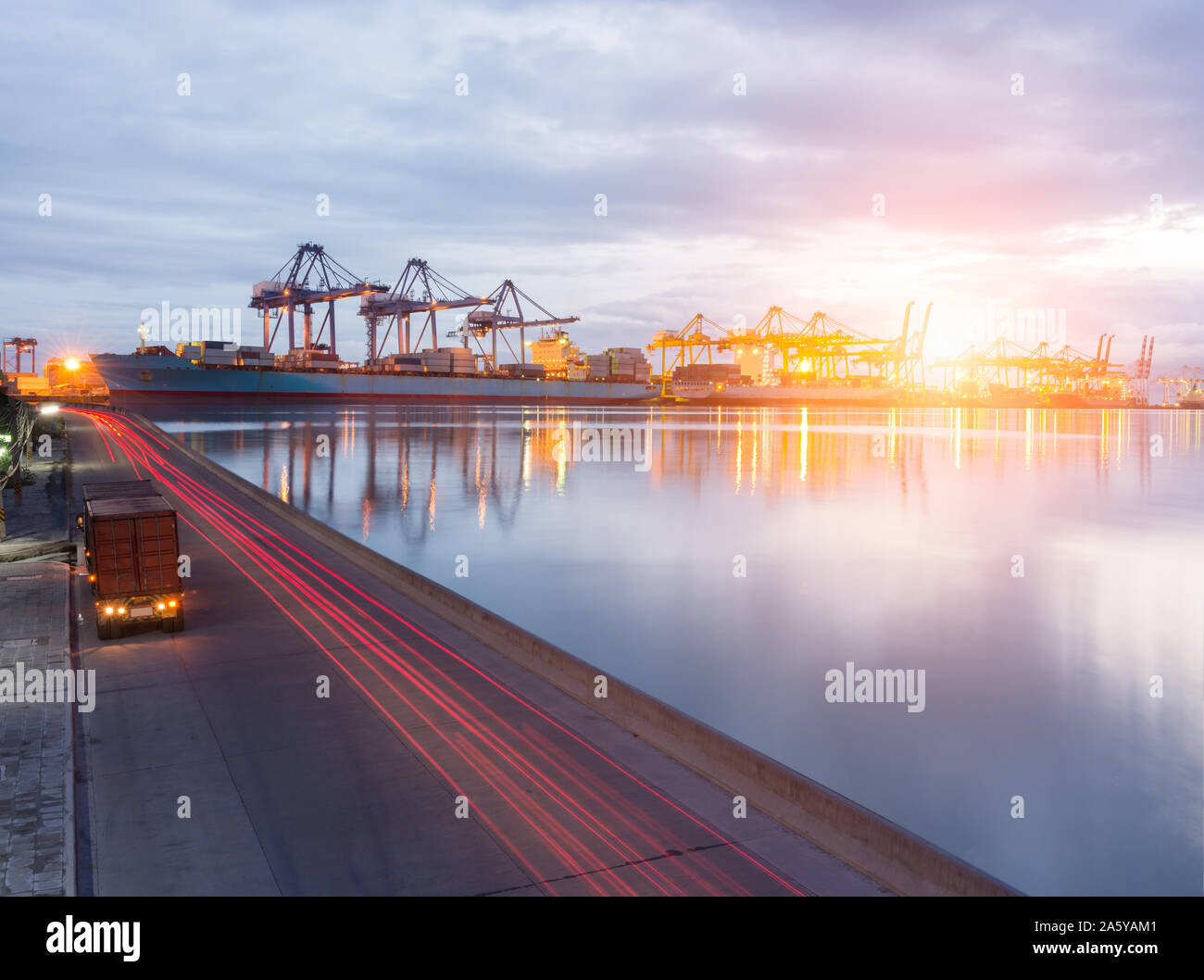 Truck transport container on road to port cargo Stock Photo - Alamy