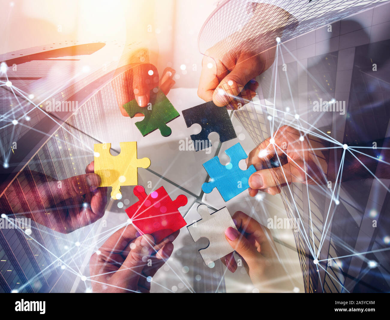 Business team connect pieces of puzzles. Teamwork, partnership and ...
