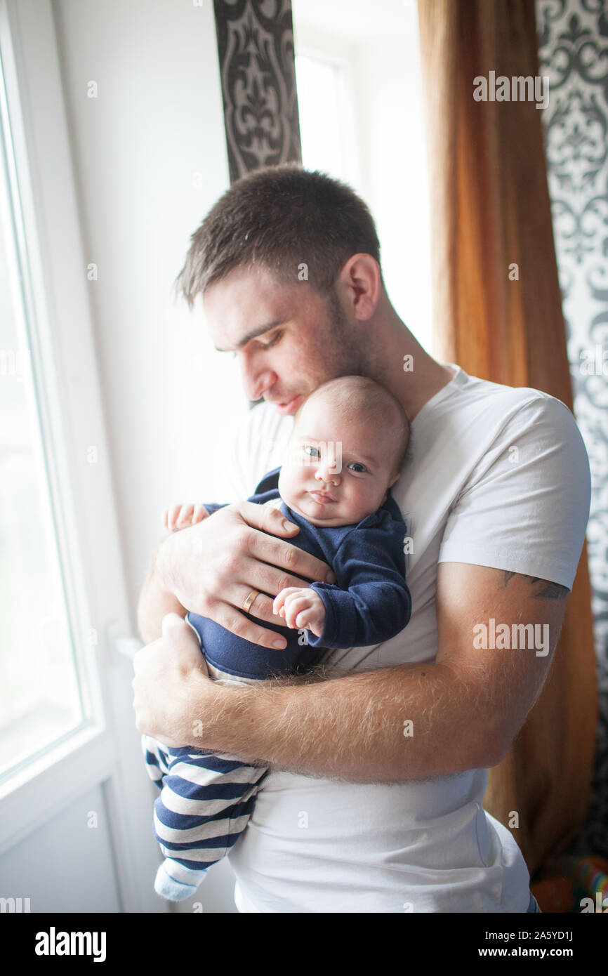 Father holding his little baby Stock Photo - Alamy