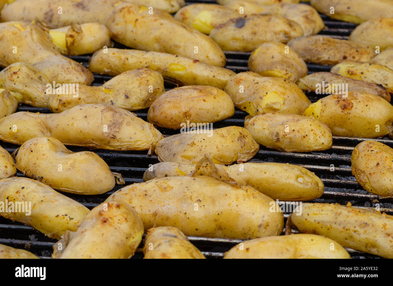 Ukrainian Traditional Food Mass Of Potato Halves In Peels Baking On A
