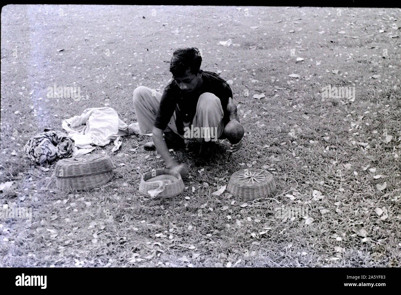 Snake charmer in Singapore 1954 Stock Photo - Alamy